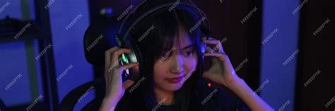 Premium Photo Female Cyber Hacker Gamer In Headphone Watching Video