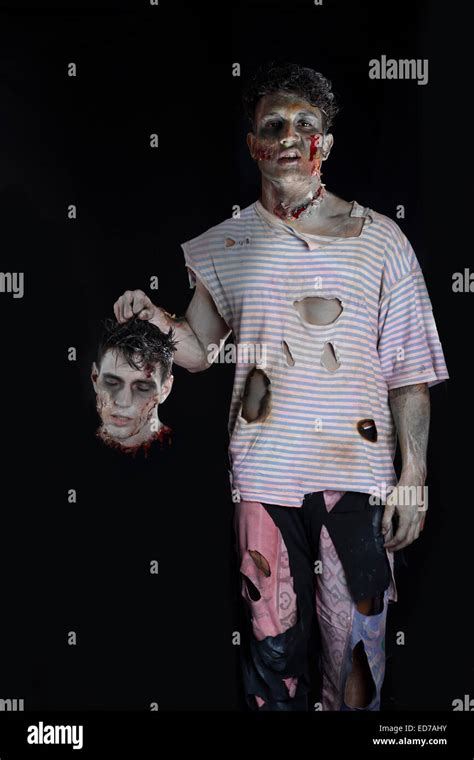 Scary Male Zombie Holding Another Man S Head Stock Photo Alamy
