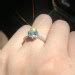 Engravable Twist Solitaire With Side Accent Round Cut Moissanite Promise Ring