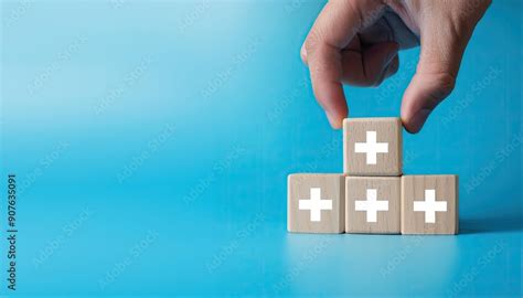 Value Add Concept Hand Place Wooden Cube With Plus Sign On Light Blue Background Positive Value Add Concept Hand Place Wooden Cube With Plus Sign On Light Blue Background Positive