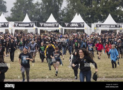 Festival Visitors Storm Onto The Infield At The Wacken Open Air In