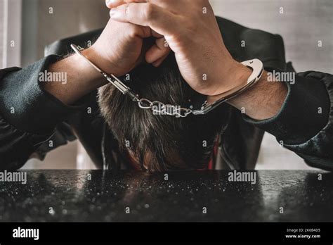 A Dangerous Criminal Is Handcuffed In Prison For Interrogation A