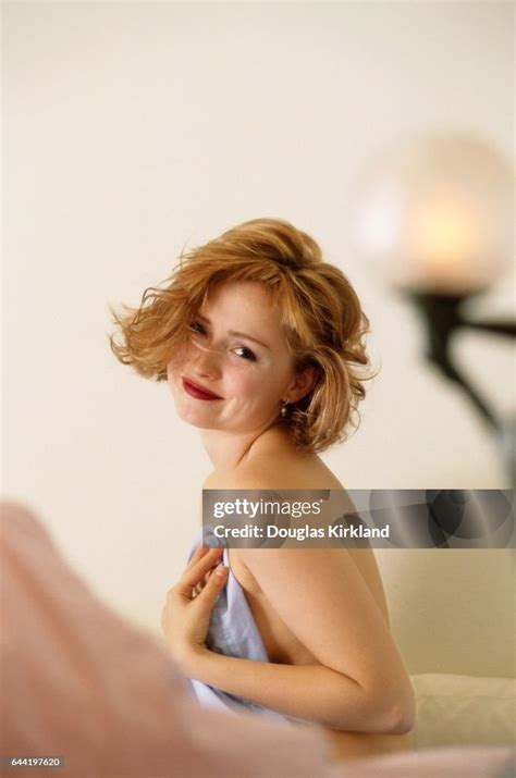 American Actress Nina Siemaszko Smiles As She Covers Herself With A