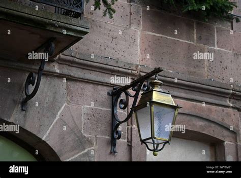 Antique Brass Wall Lantern On The Exterior Of A Half Timbered Building In Bergheim Alsace