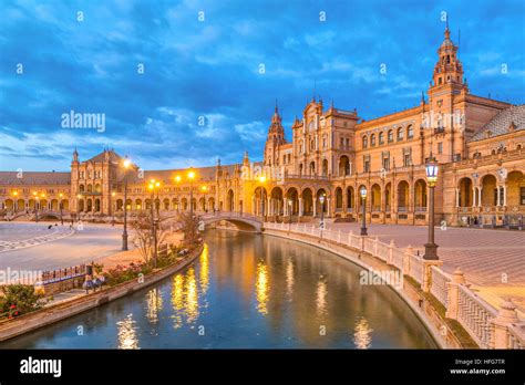 Canal And Bridge Reflecing In Water On Plaza De Espana In The Evening