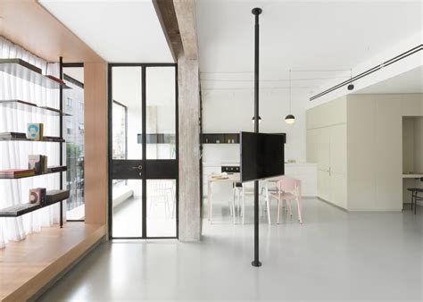 Thin Black Frames Draw The Eye Around A Renovated Tel Aviv Apartment