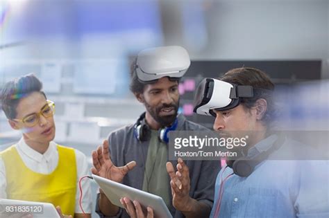 Computer Programmers With Digital Tablet Programming Virtual Reality