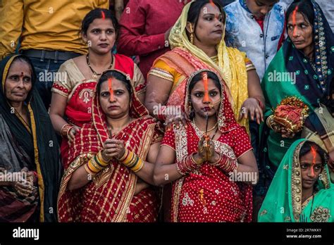Devotees Make Offerings And Pray In The Ganges During Chhath Puja In