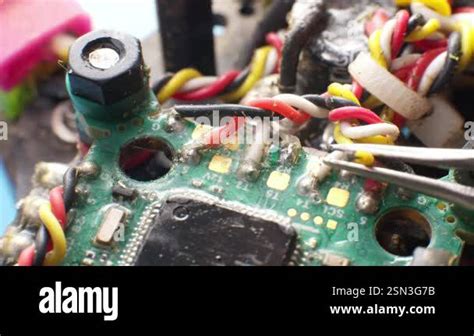 Extreme Close Up Macro Shot Of A Wire Being Prepared For Soldering On A Drone Control Board
