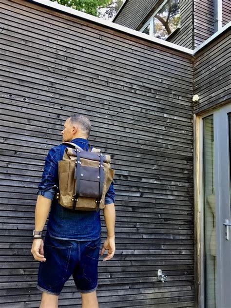 Hipster Backpack In Waxed Canvas With Roll Up Top And Double Bottle