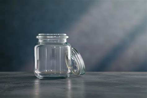 A Clear Glass Jar With A Clear Lid Sits On A Table Premium Ai