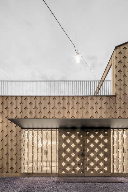 Pedevilla Architects Lines Cookery School With Perforated Timber Panels