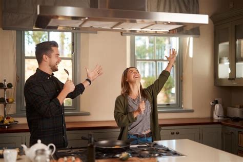 Premium Photo Food Sing And A Funny Couple In The Kitchen Of Their