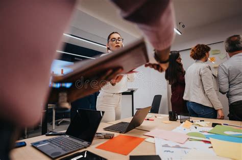 Multiracial Team Brainstorming Successful Business Strategies In A Collaborative Workshop Stock