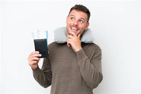 Premium Photo Young Caucasian Man Holding A Passport Isolated On