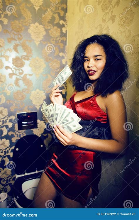 Pretty Young African American Woman In Luxury Restroom With Mone Stock