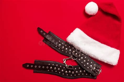 Red Color Banner With Black Leather Bracers And Metal Rivets For