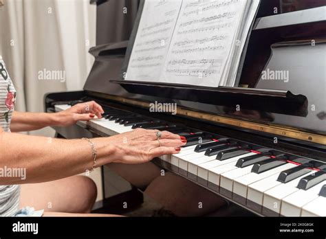 Beautiful Brazilian Pianist Woman Touching Piano Keys Playing Upright