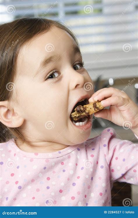 Girl Eating Cookie Stock Image Image Of Girl Color 2284527