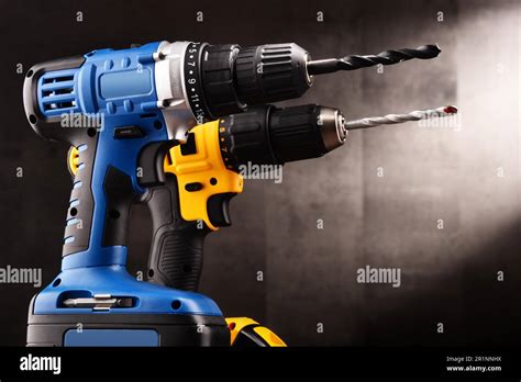 Two Cordless Drilsl With Drill Bits Working Also As Screw Guns Stock