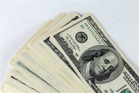a skewed stack of old us dollar banknotes on white background close