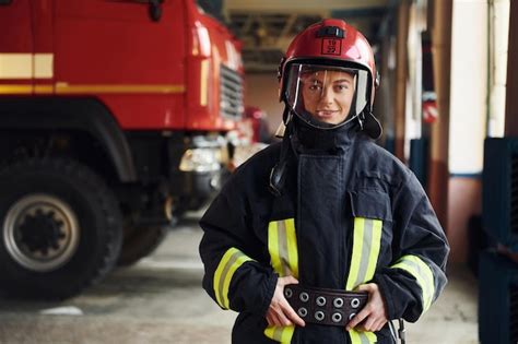 Premium Photo Female Firefighter In Protective Uniform Standing Near Truck