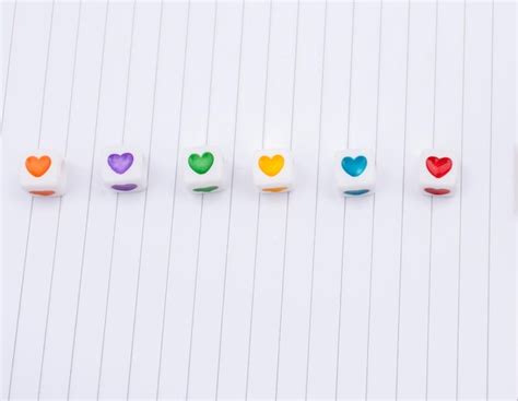 Premium Photo Love Cubes And Paper Arrow On A Notebook