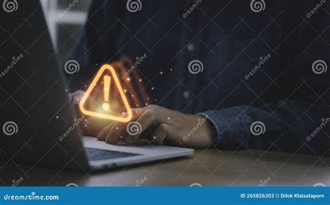 Businessman Using Computer Laptop With Red Triangle Caution Warning