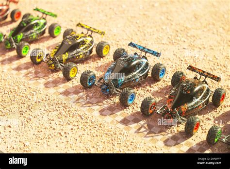 Multiple Colourful Remote Controlled Buggy Cars On Start Line In The