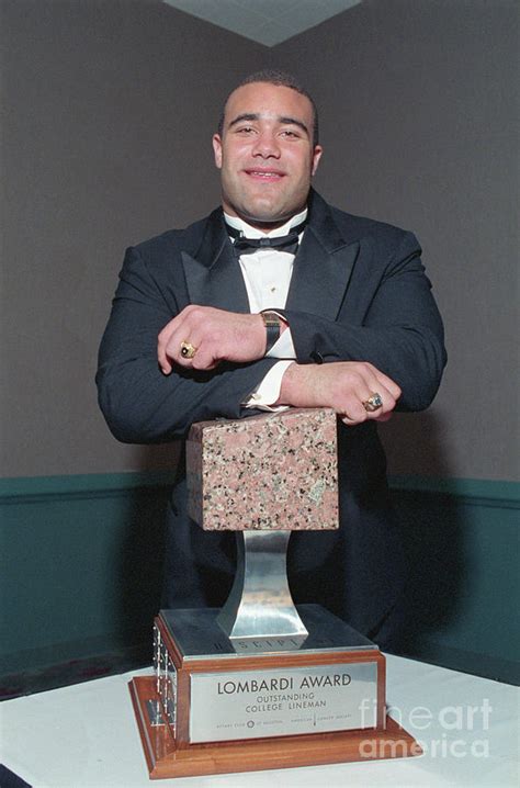Chris Zorich Holding Lombardi Award By Bettmann