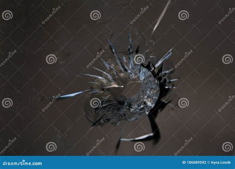 Broken Glass Hole Cracks In The Window From The Fragment Of The
