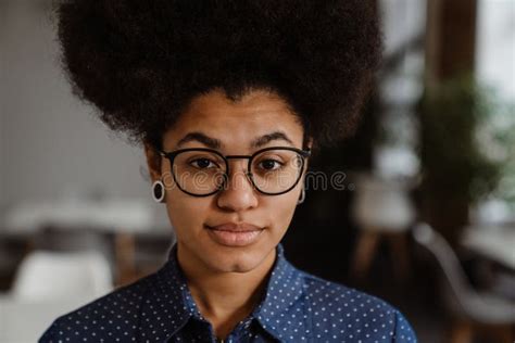Portrait Of African Business Woman Standing In Office Stock Image
