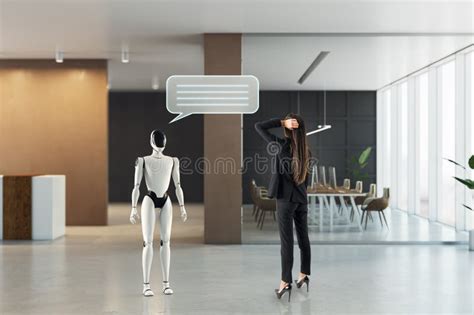 Businesswoman Interacting With Humanoid Robot In Modern Office Space