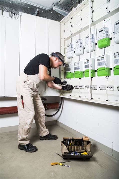 Electrician Testing Fuse Box Or Switch Box With Measuring Device Stock Photo Image Of