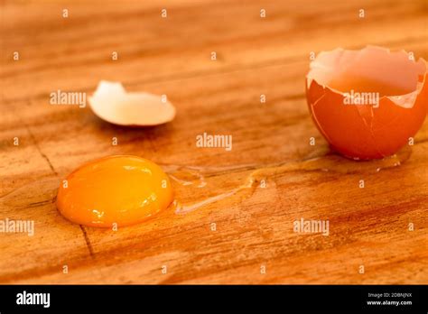 Raw Broken Colour Egg With Yellow Yolkchicken Raw Farm Eggs On Old