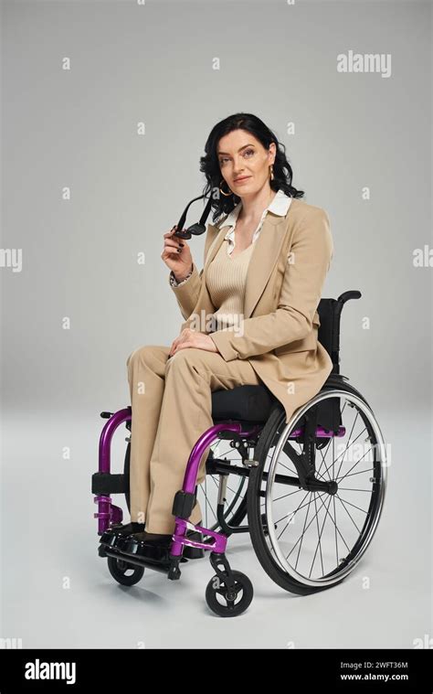 Beautiful Confident Woman With Disability In Wheelchair Looking At