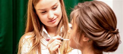 Makeup In The Process The Makeup Artist Applies Pink Gloss Lipstick On