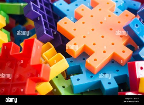 Colorful plastic jigsaw puzzle game Stock Photo - Alamy
