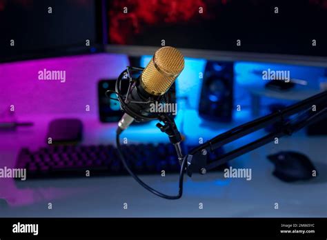 Condenser Microphone In Gamer Setup With Monitors Keyboard Mouse And