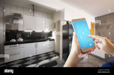Female Hand Is Adjusting Lighting With Smart Phone Smart Home Control Concept Stock Photo Alamy