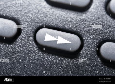 Macro Of A Black Fast Forward Button On Black Remote Control For A Hifi Stereo Audio System