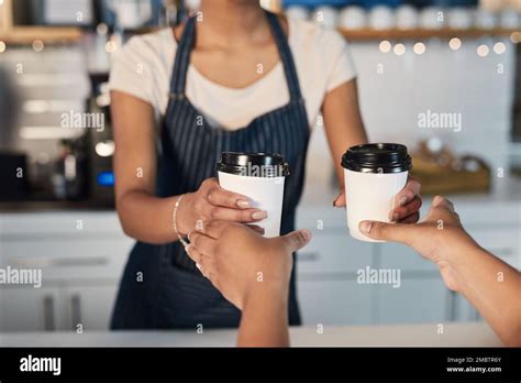 Its Another Busy Day In Her Specialty Coffee Shop Closeup Shot Of A Barista Serving Coffee To A