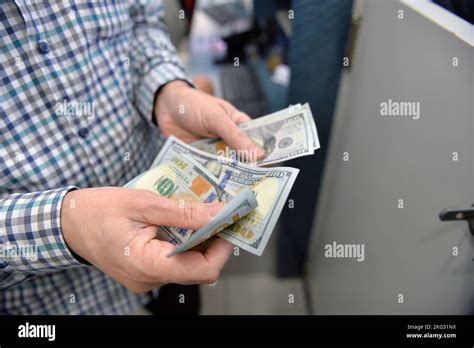 Cash In Hands Profits Savings Stack Of Dollars Man Counting Money