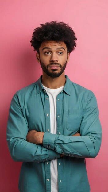 Horizontal Shot Of Hesitant Handsome Dark Skinned Male Shrugs Shoulders