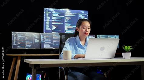 Asian Female Programmer Yawning And Sleeping While Writing Code By A Laptop Using Multiple