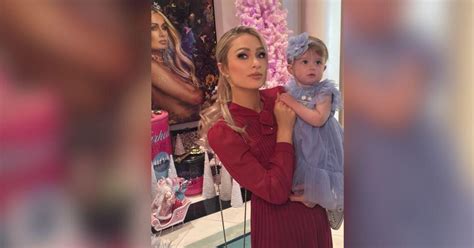 Paris Hilton Goes Nude Wears Only A Bow In Christmas Video Watch