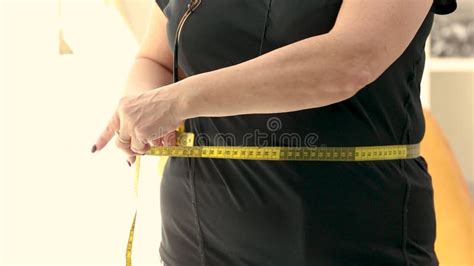 Woman Measuring Her Waist To Achieve Fitness Goals Stock Footage