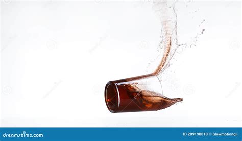 Glass Falling And Red Wine Splashing Against White Background Stock