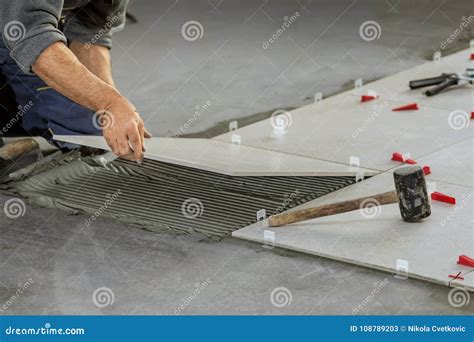 Ceramic Tiles Tiler Placing Ceramic Wall Tile In Position Over Stock