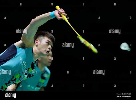 Taiwan S Wang Chi Lin Front With Lee Yang Returns A Shot Against Japan S Takuro Hoki And Yugo